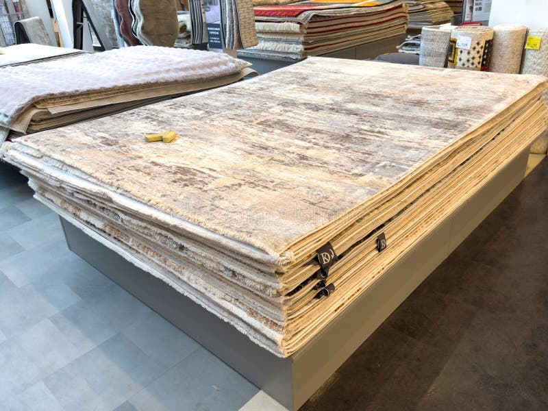 Large Display of Various Rugs and Carpets in Store Setting Editorial ...