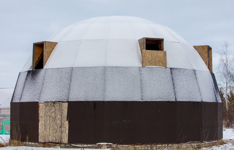 A Large Dome-shaped Building Covered in Snow Stock Photo - Image of ...