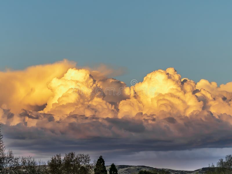 Large Storm Clouds Over a Mountain Range at Sunset with Copy Space ...