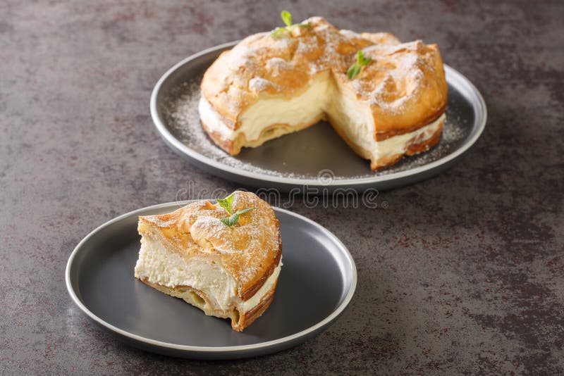 Large Eclair Choux Pastry Cake with Custard Filling Close-up in a Plate ...