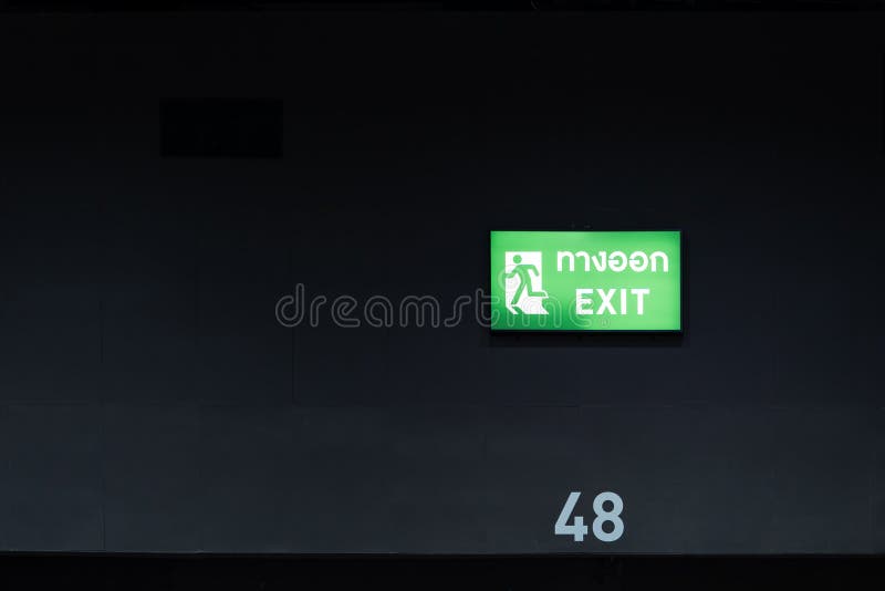 Large Emergency Exit Sign Green Light Box is Placed on the Wall of ...