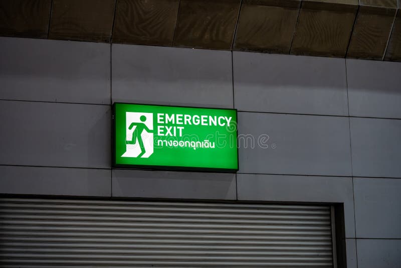 Large Emergency Exit Sign Green Light Box is Placed on the Wall of ...