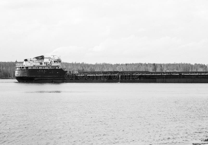 .a Large Empty Barge Floats on the River. Side View Stock Photo - Image ...