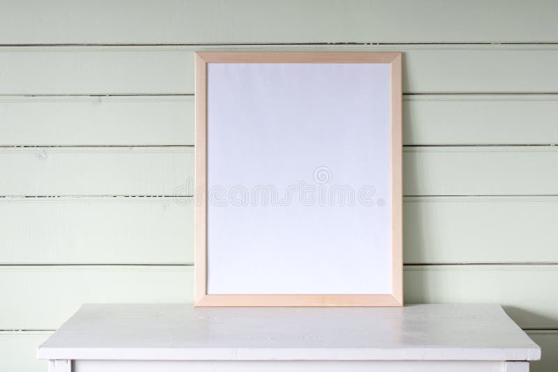 Large Empty Frame on a White Table in a Clapboard Cottage. Copy the ...