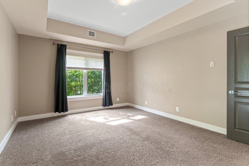 Large, Empty Room with a Black Curtain Over a Window Stock Photo ...