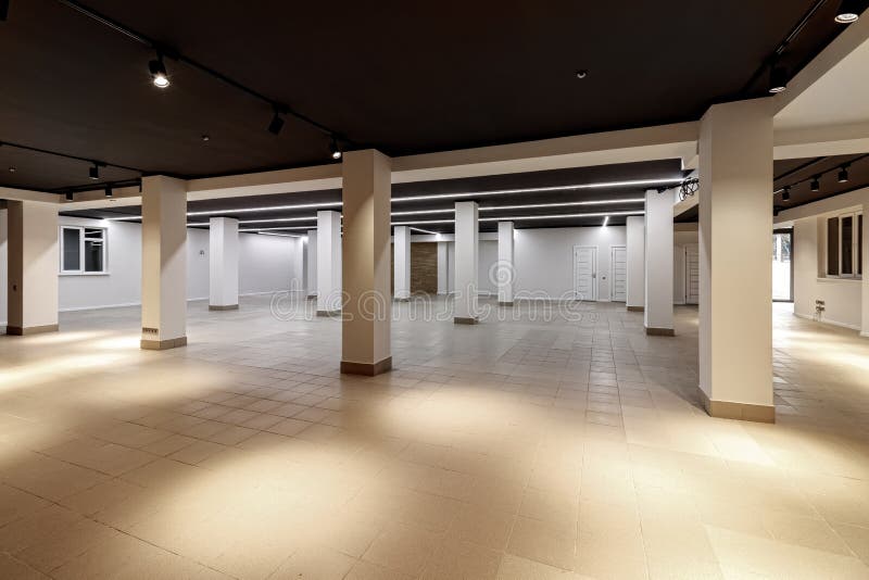 A Large Empty Room with Ceramic Tiles on the Floor, a Black Ceiling ...