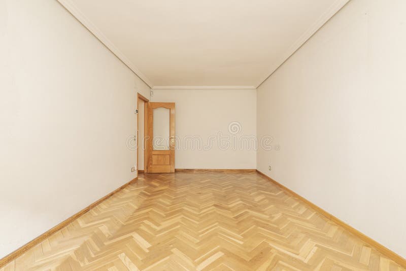 A Large and Empty Room in a House with Parquet Floors Stock Photo ...