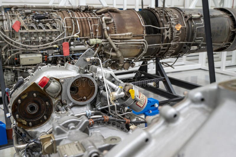 A Large Engine is Sitting in a Hangar with Other Engines. Stock Photo ...
