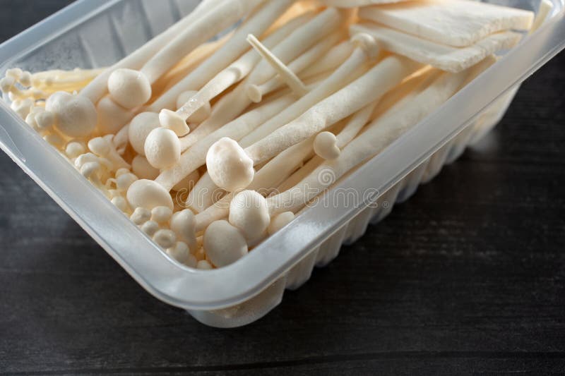 Large Enoki Mushrooms in Plastic Container Stock Photo - Image of ...