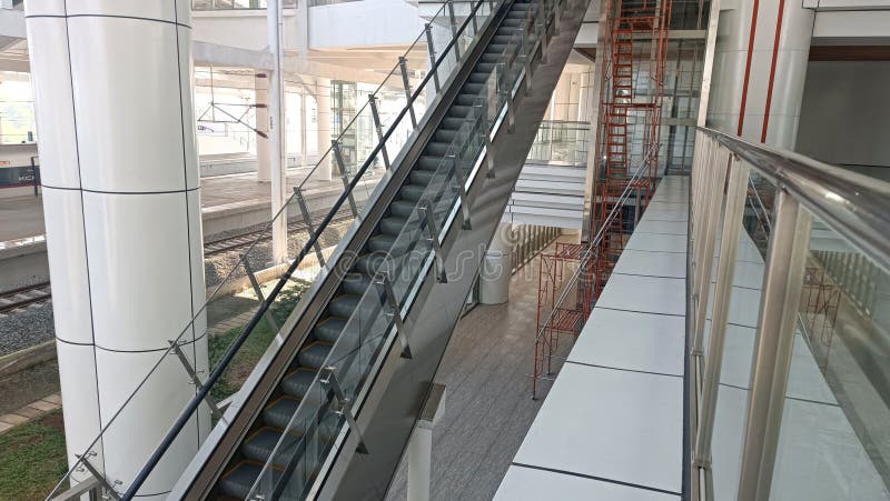 A Large Escalator is in the Middle of a Large Building Stock Image ...