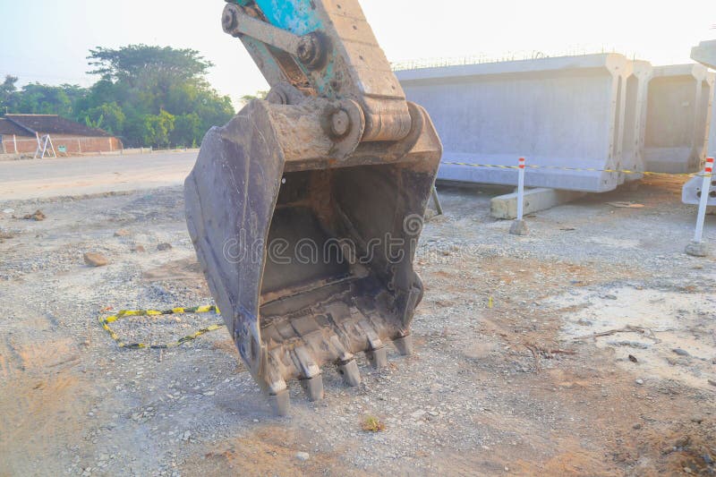 A Large Excavator or Backhoe Green and Blue Construction Machine is ...