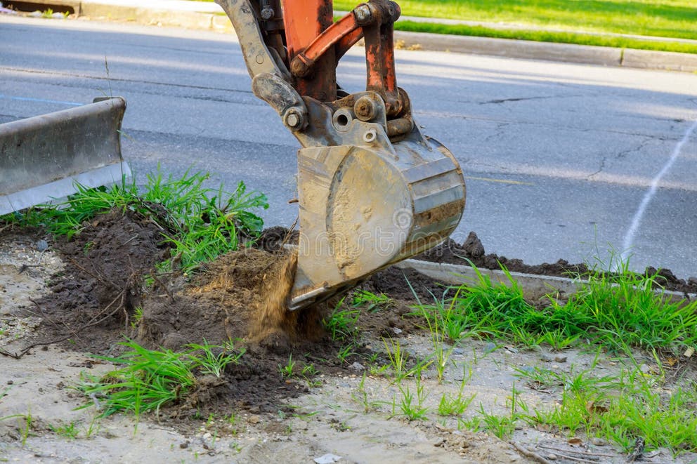 Large Excavator is Digging on Earthwork at a Industrial Site Under ...