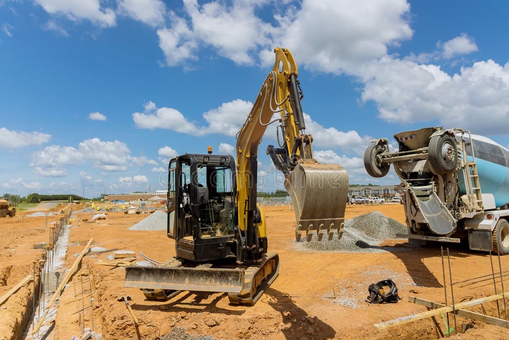 A Large Excavator Working is Dig on Earthwork an Industrial Site Under ...