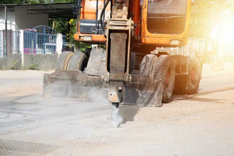 Large Excavators Drilling Roads in Road Construction Work Stock Photo ...