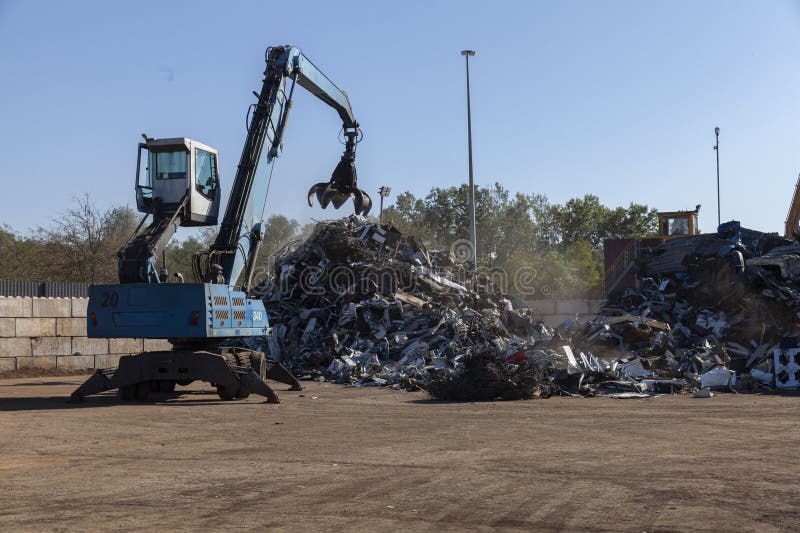 Large Excavators Work on Scrap Metal Stock Photo - Image of excavator ...