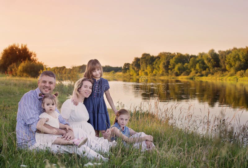 Family by summer river stock image. Image of baby, lake - 121693371