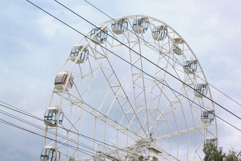 Large Ferris Wheel is Spinning in an Amusement Park. Stock Image ...