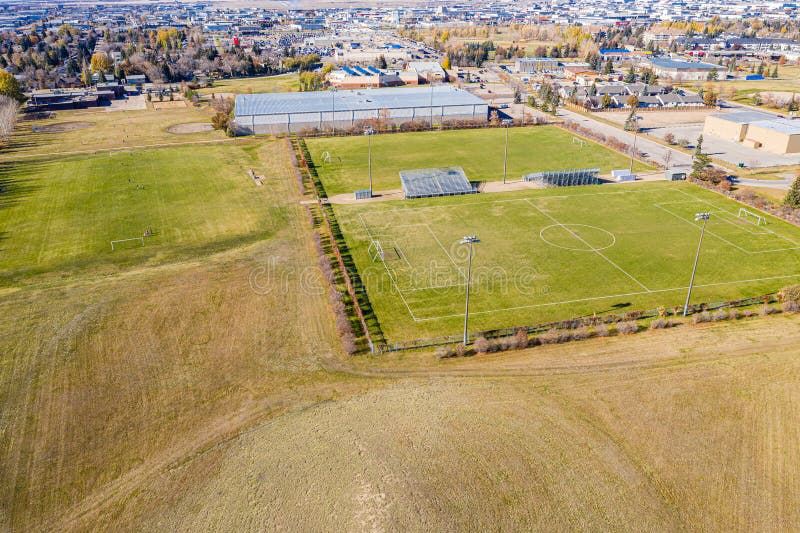 Large Field with a Building in the Background Stock Image - Image of ...
