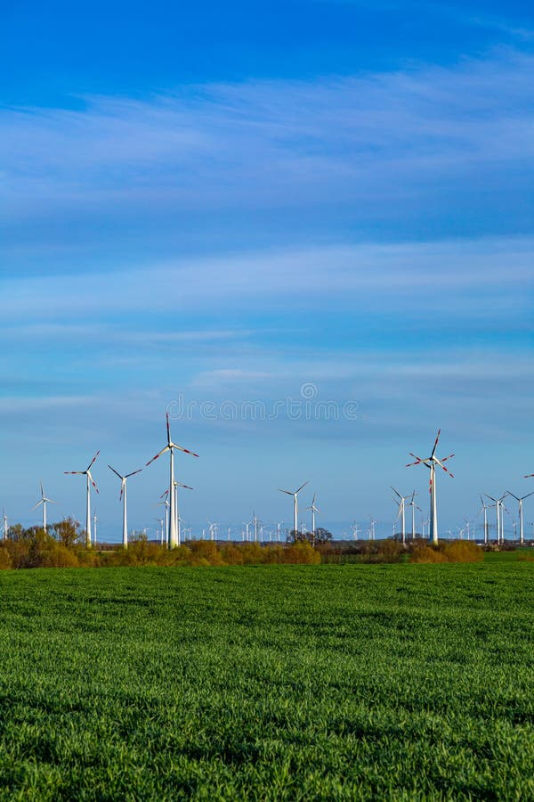 A Large Field and Wind Turbines Stock Photo - Image of energy ...