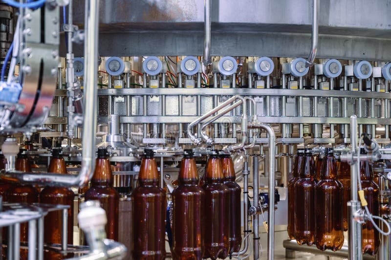 Large Filling Machine, the Process of Filling Plastic Bottles with ...