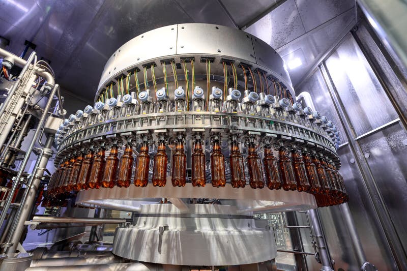 Large Filling Machine, the Process of Filling Plastic Bottles with ...