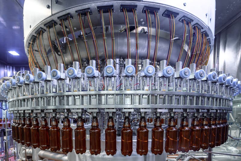 Large Filling Machine, the Process of Filling Plastic Bottles with ...