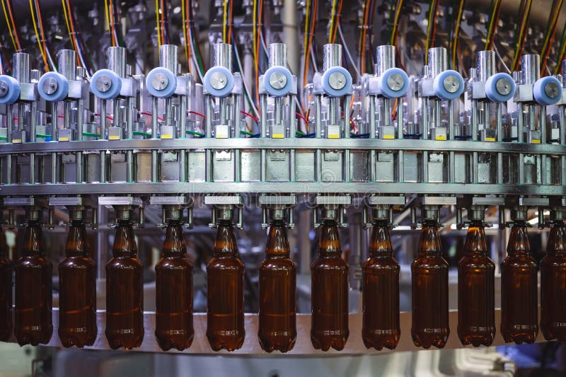 Large Filling Machine, the Process of Filling Plastic Bottles with ...