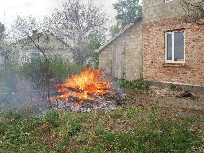 A Large Fire Burning Near the House Stock Photo - Image of destruction ...