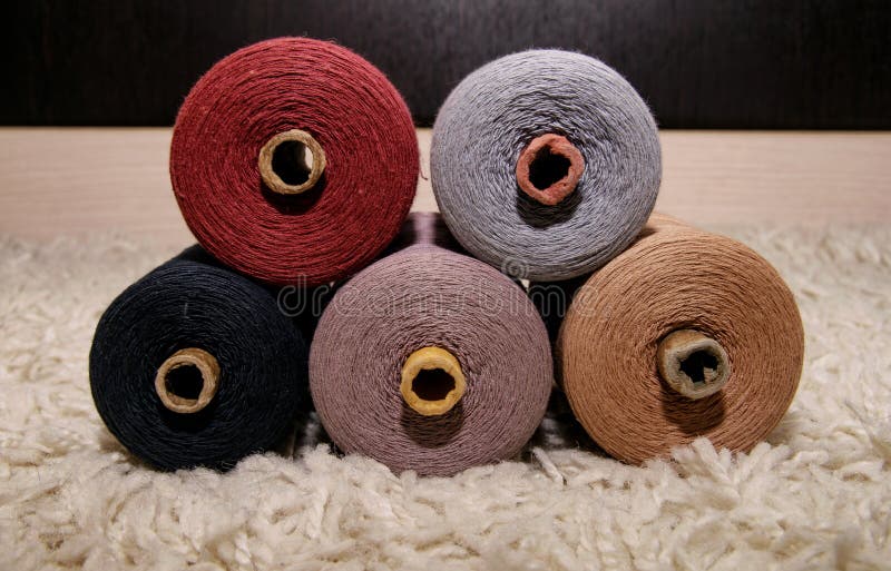 Five Spools of Thread Lie on Top of Each Other on a White Background ...