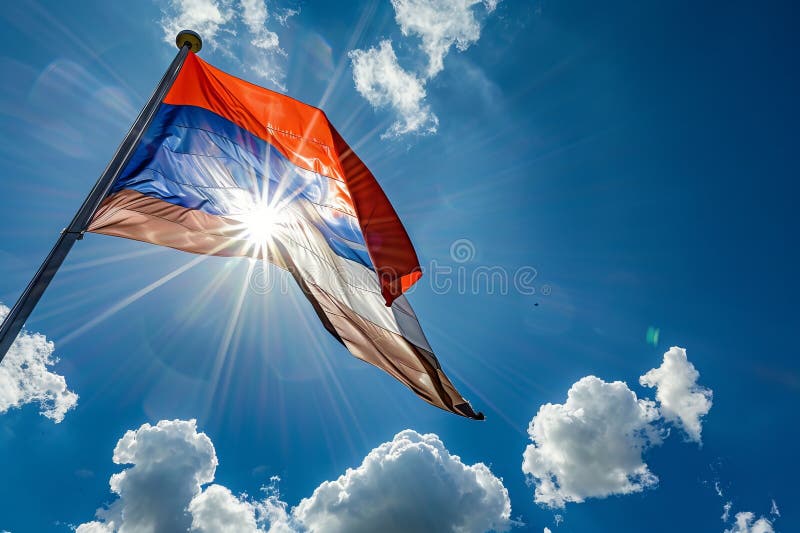 A Large Flag is Flying in the Sky with the Sun Shining Stock Image ...