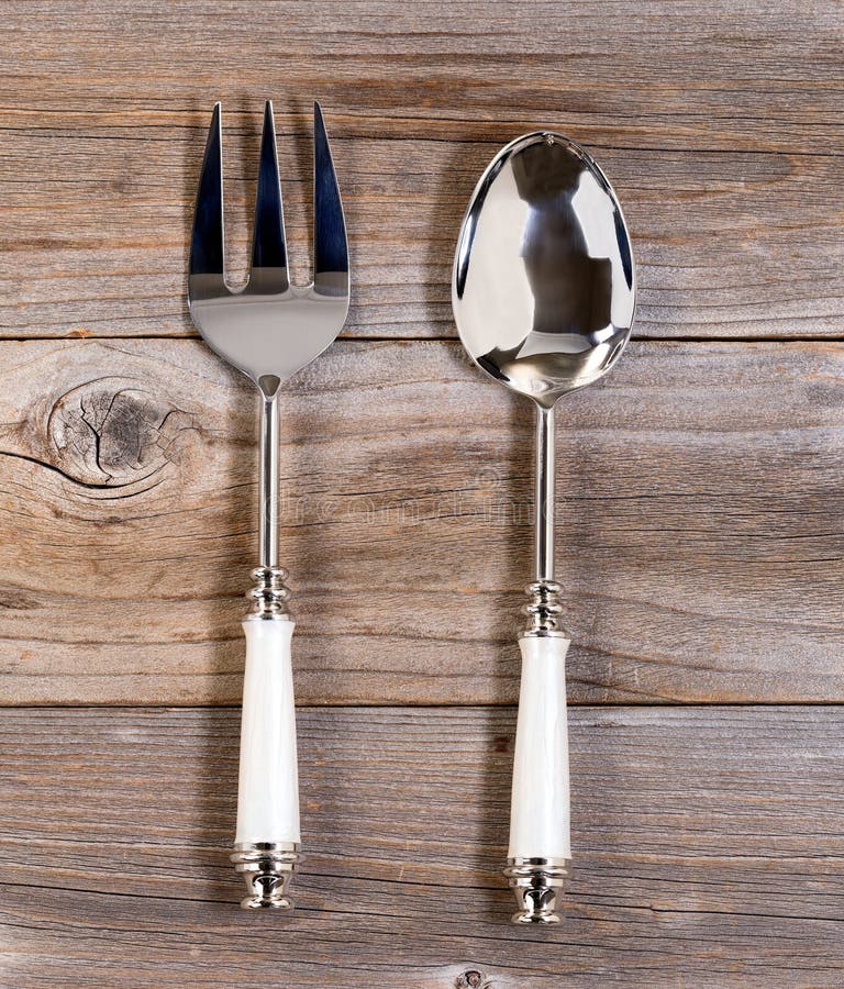 Large Fork and Spoon on Rustic Wood Stock Photo - Image of overhead ...