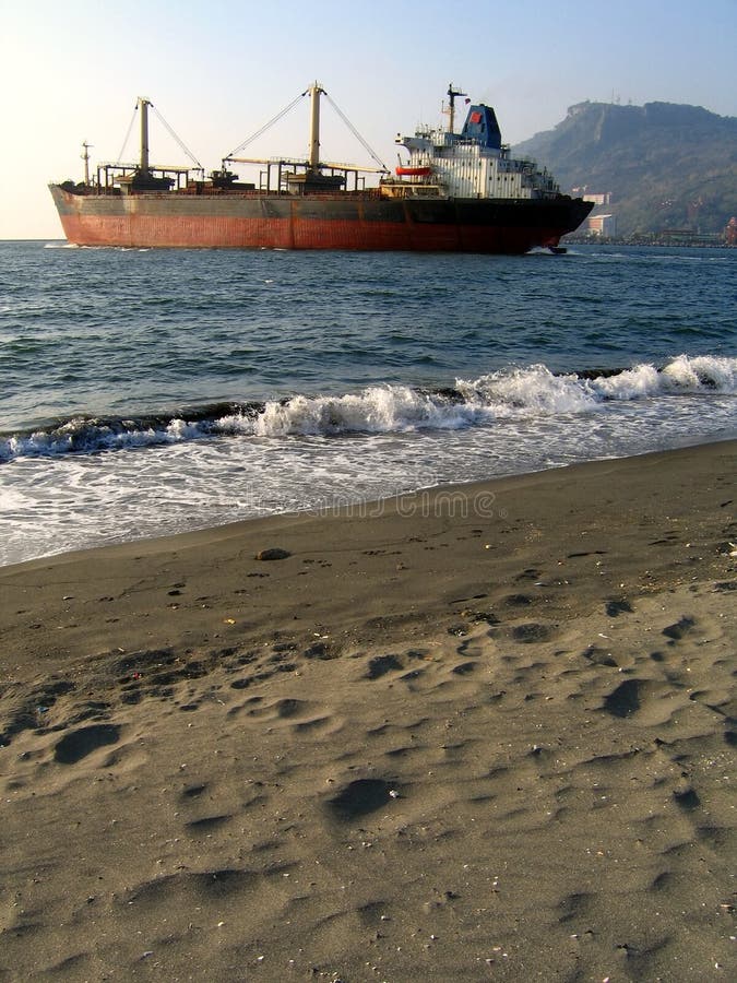Large Freighter stock photo. Image of hull, mountain, seashore - 843420