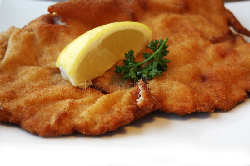 Large Fresh Schnitzel with Lemon Stock Image - Image of fish, dinner ...