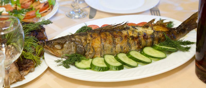 Large Fried Fish on a Platter with Vegetables Stock Photo - Image of ...