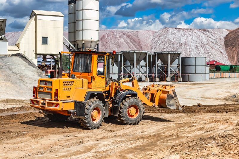 A Large Front Loader Transports Materials in a Concrete Production ...