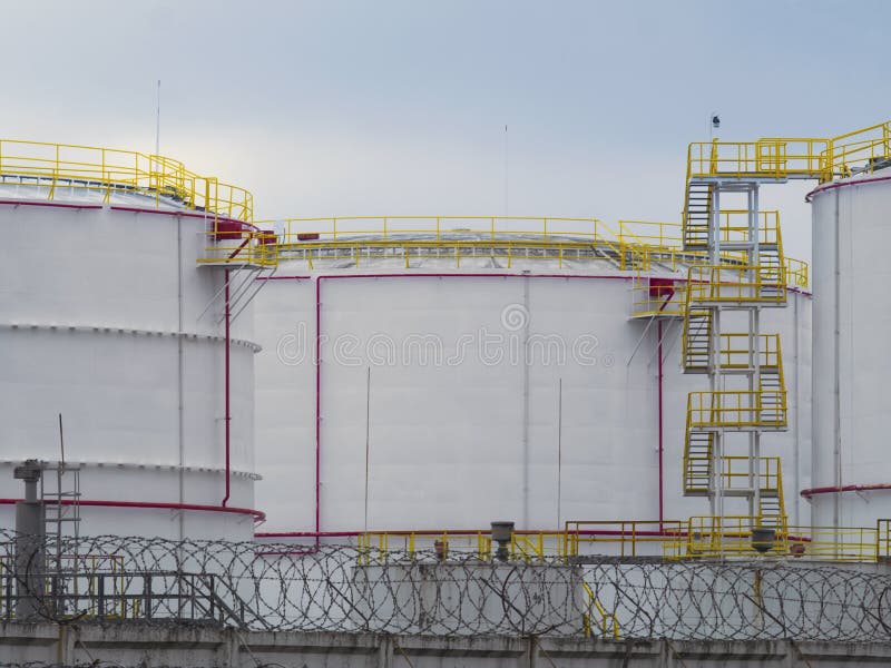 Large Fuel Tanks in a Fenced Area Stock Image - Image of energy, bright ...