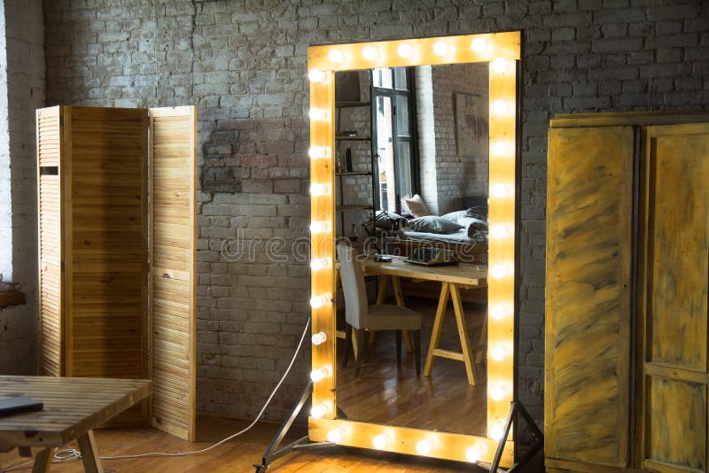 Large Full-length Mirror in a Room with a Brick Wall and a Window Stock ...