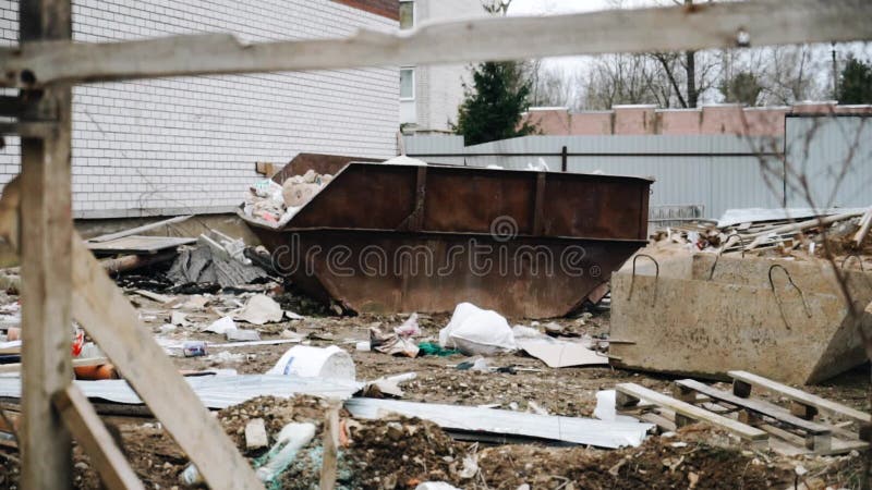 A Large Garbage Can at a Construction Site Stock Footage - Video of ...