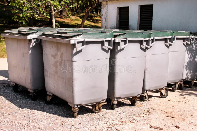 Large Garbage Containers, Trash Dumpsters and Bins Standing in Row ...