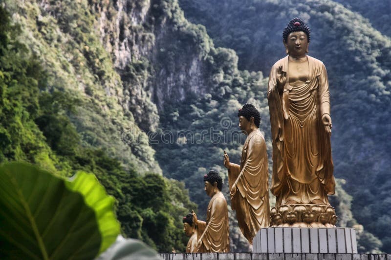 Large Gilded Statues in Taroko Gorge, Taiwan Stock Photo - Image of ...