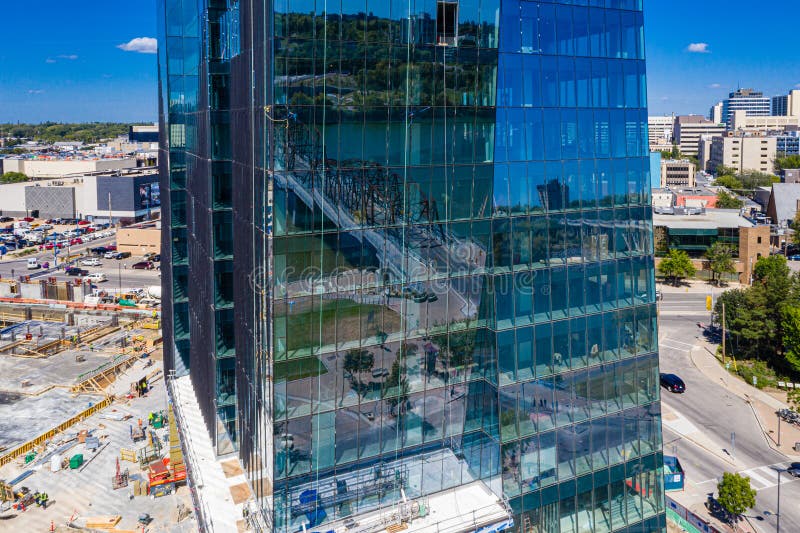 A Large Glass Building with a Lot of Windows and a Large Entrance Stock ...