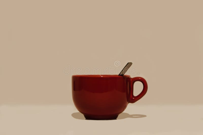 Large Glossy Red Round Cup with a Handle and a Spoon Stock Photo ...