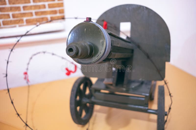A Large Green Machine Gun on a Pedestal with a Muzzle Aimed at Us ...
