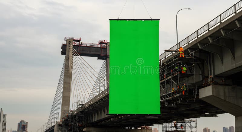 Green Screen Banner Hanging Beneath Construction of a Modern Cable ...