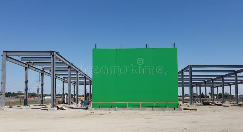 Construction Site with Green Wall: Industrial Building Under ...