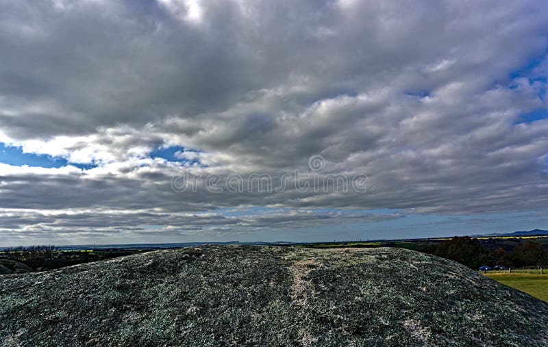 Large Grey Boulder with Clouds on Top Stock Photo - Image of view ...