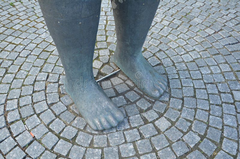 Large Grey Feet of Statue with Cobblestone Ground Stock Photo - Image ...
