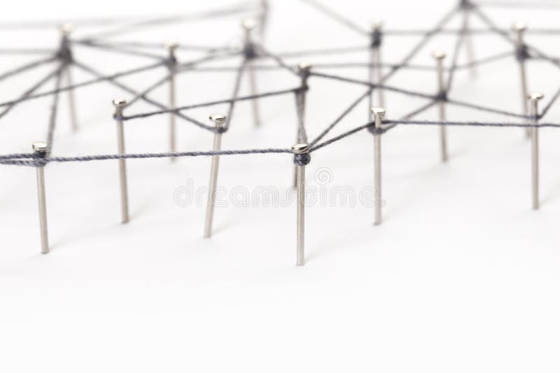 A Large Grid of Pins Connected with String. Communication, NetwA Large ...