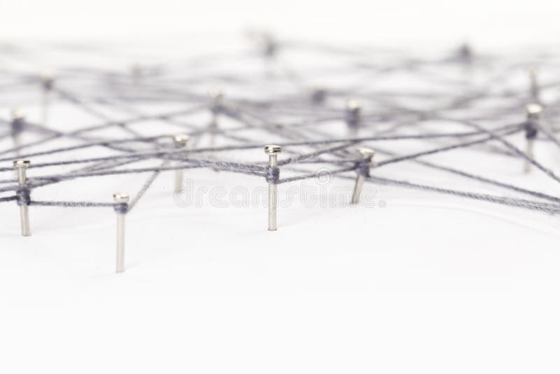 A Large Grid of Pins Connected with String. Communication, NetwA Large ...