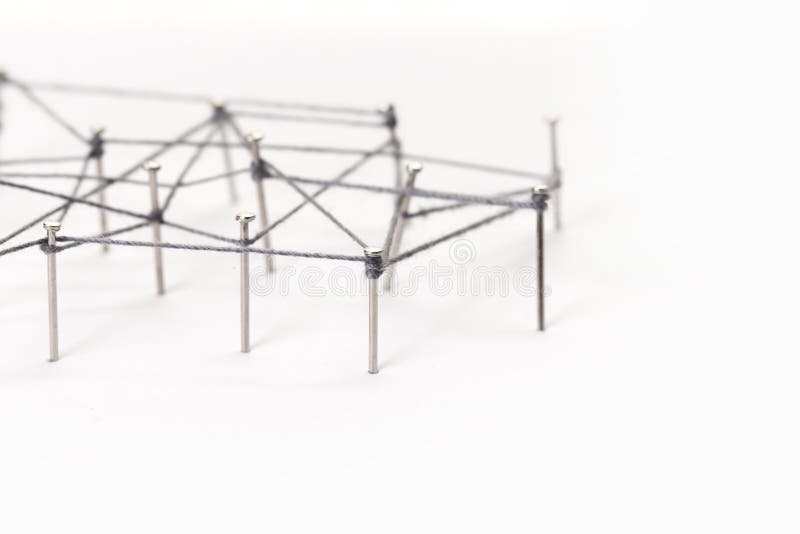 A Large Grid of Pins Connected with String. Communication, NetwA Large ...